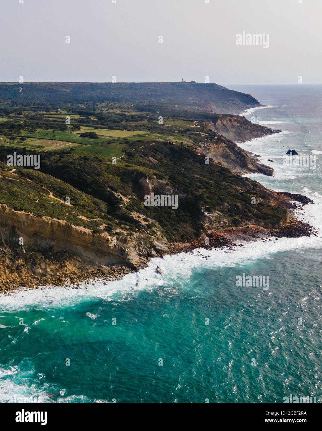 Aerial view of wild coastline with Atlantic Ocean waves near Praia da ...