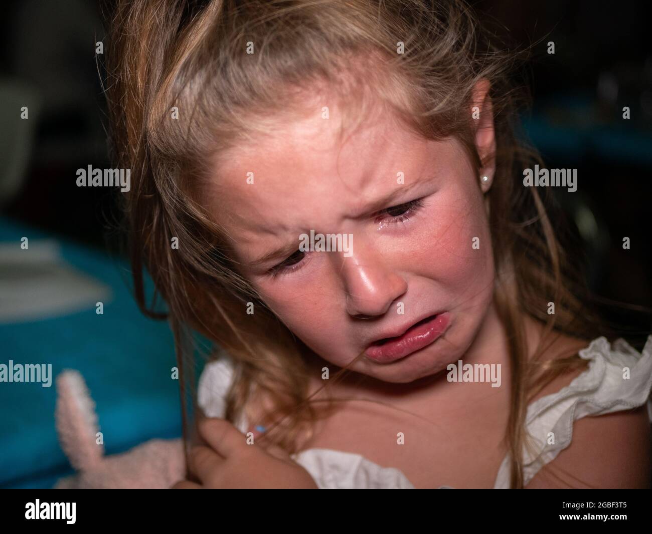 Young little girl worried and upset with something Stock Photo - Alamy