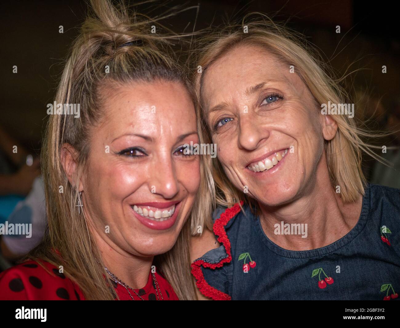 Headshot of two happy Spanish women having fun at the party Stock Photo ...