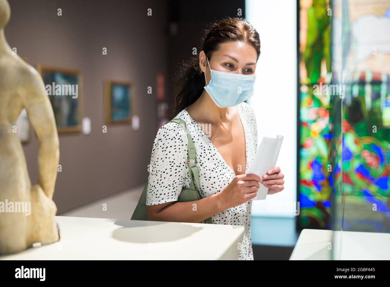 Adult woman in museum Stock Photo - Alamy