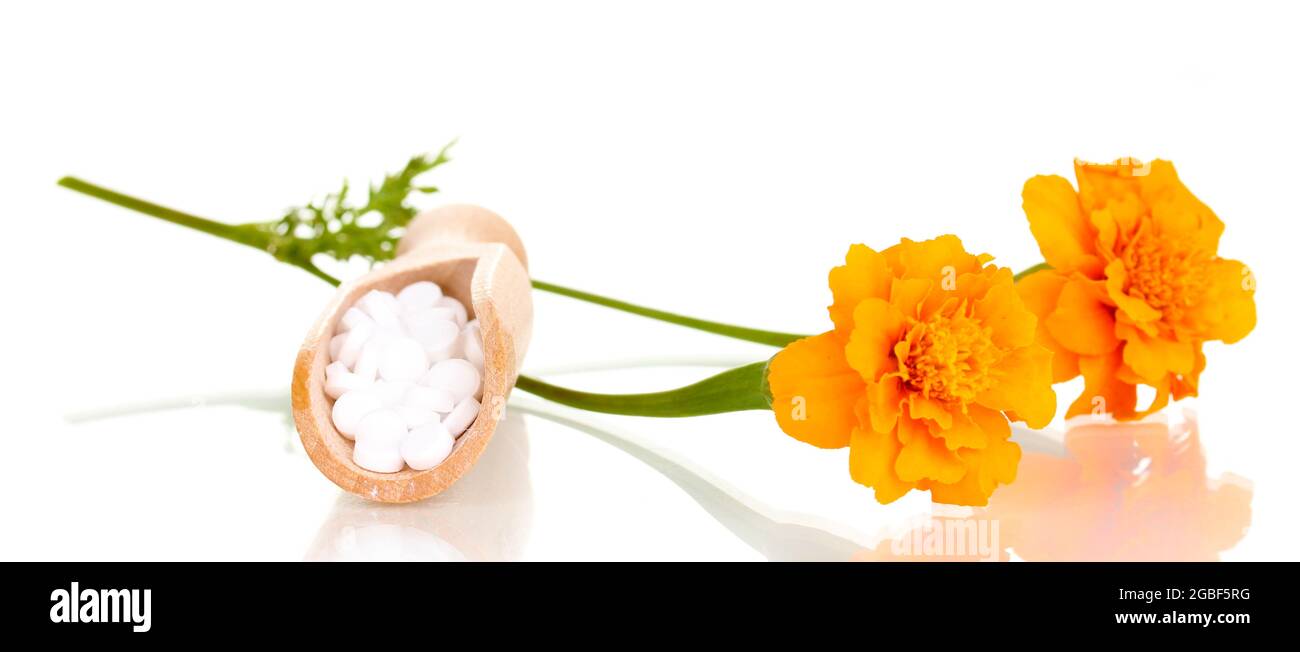 homeopathic tablets and flowers isolated on white Stock Photo - Alamy