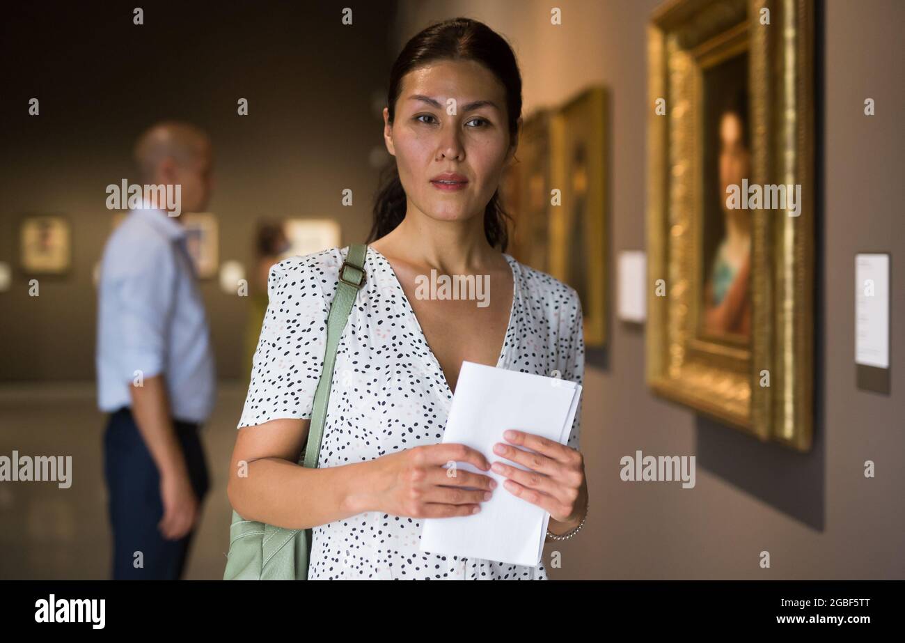 woman admiring art work Stock Photo - Alamy