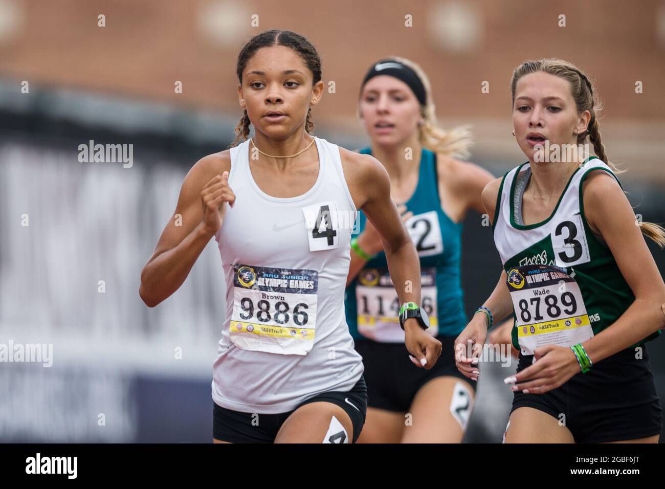 August 3, 2021: Alyvia Brown, left, takes the lead in the Girls 1500 ...