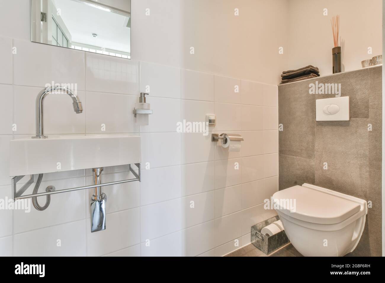 Interior of small clean washroom in miniature style Stock Photo - Alamy