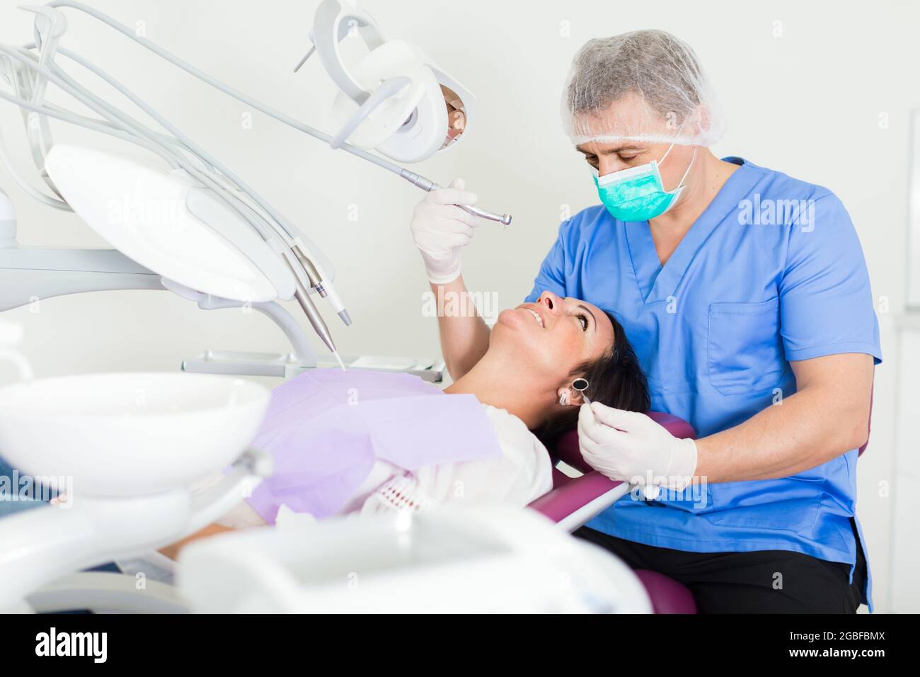 adult dentist checking teeth Stock Photo - Alamy