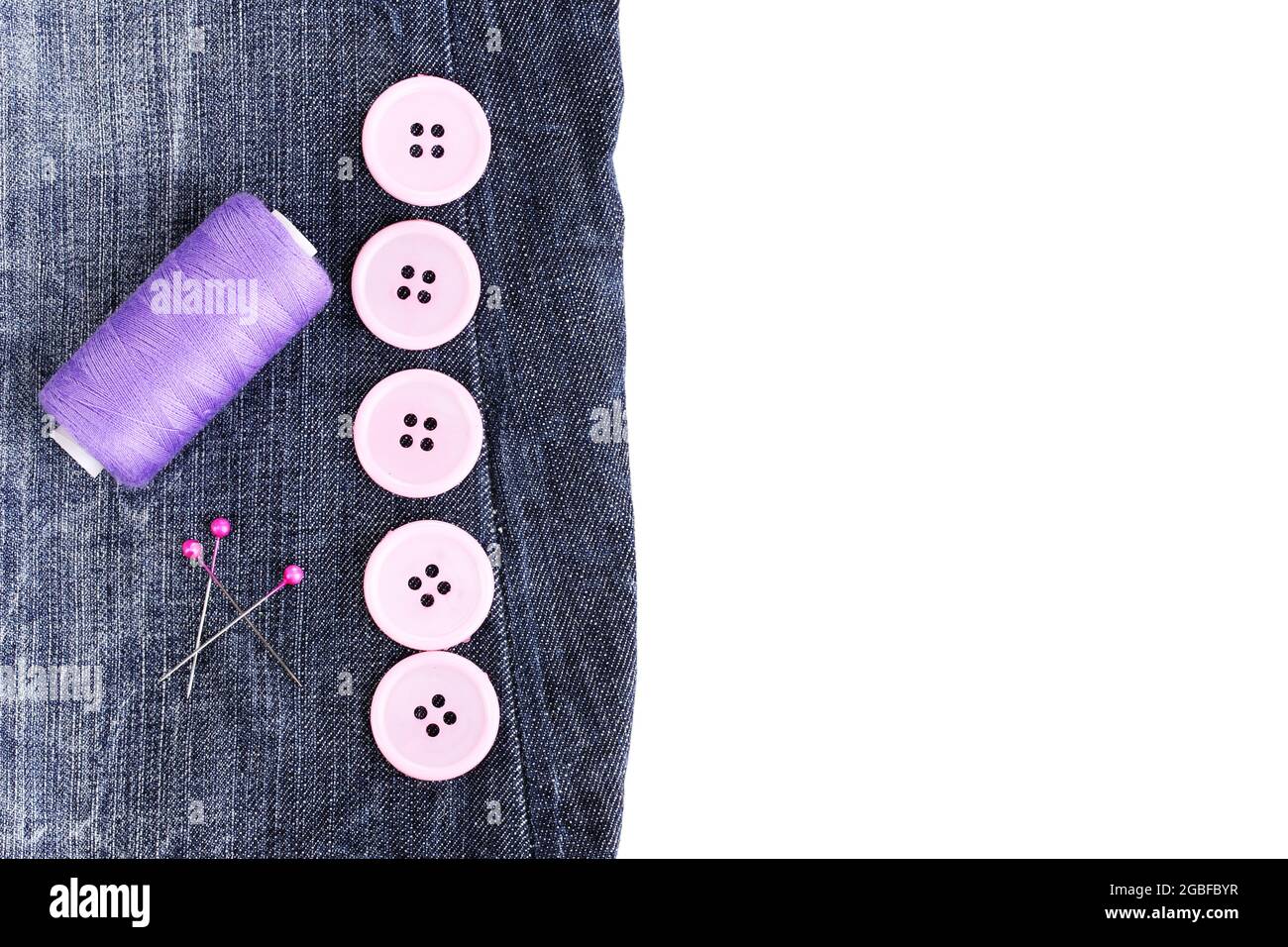 Colorful sewing buttons with thread on jeans isolated on white Stock ...