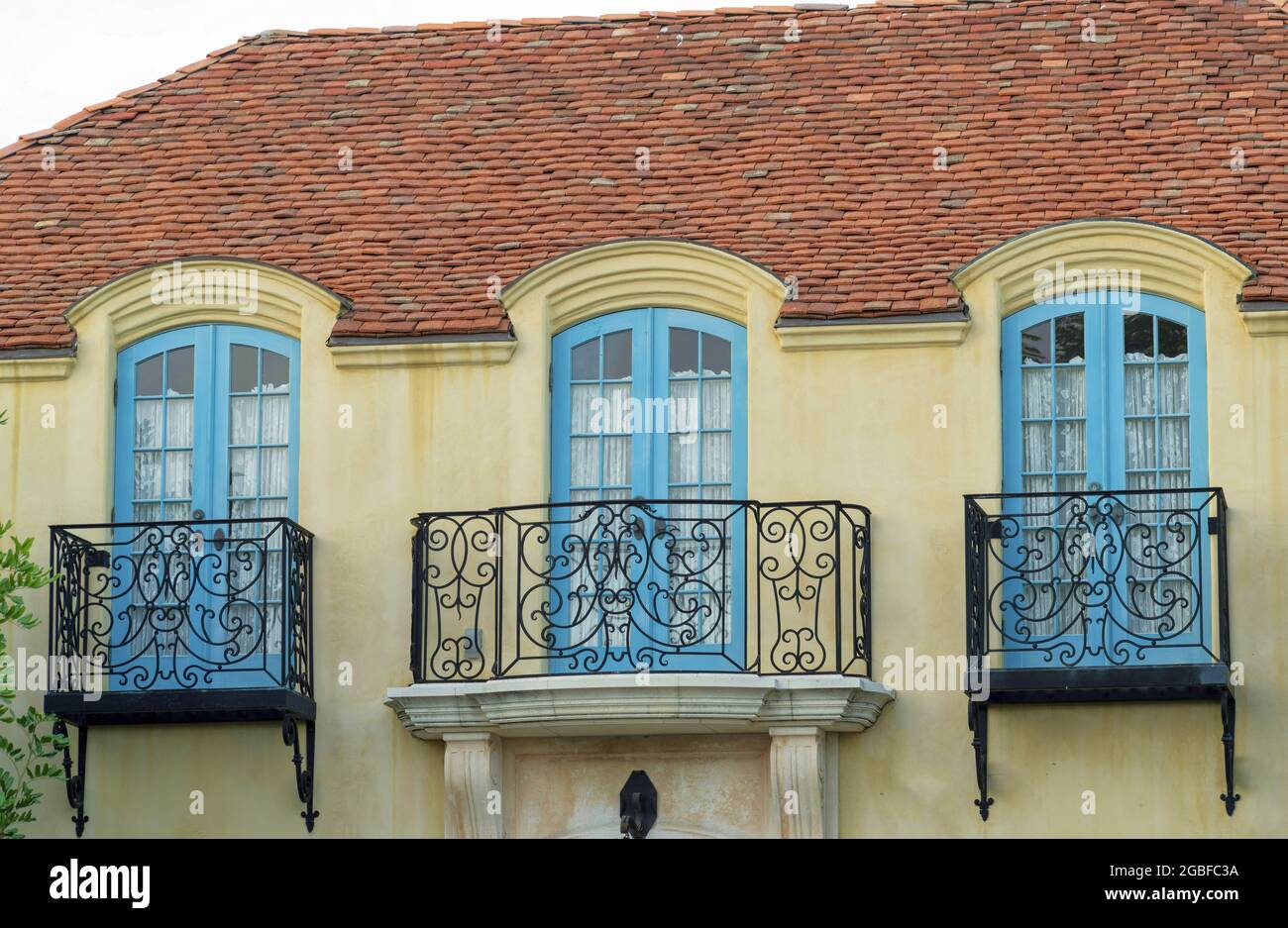 Facade of a beautiful residential house with a tiled roof Stock Photo ...