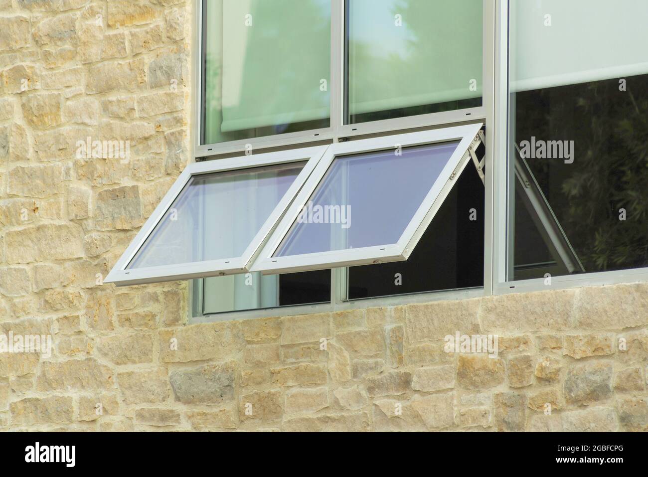 Facade of a building with open windows Stock Photo - Alamy