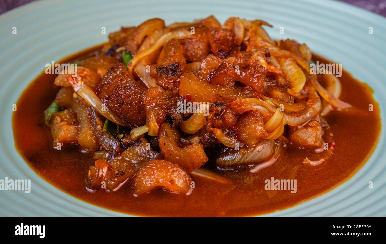 Cow skin stir fry in spicy soy sauce with onion, bird eye chilli and ...