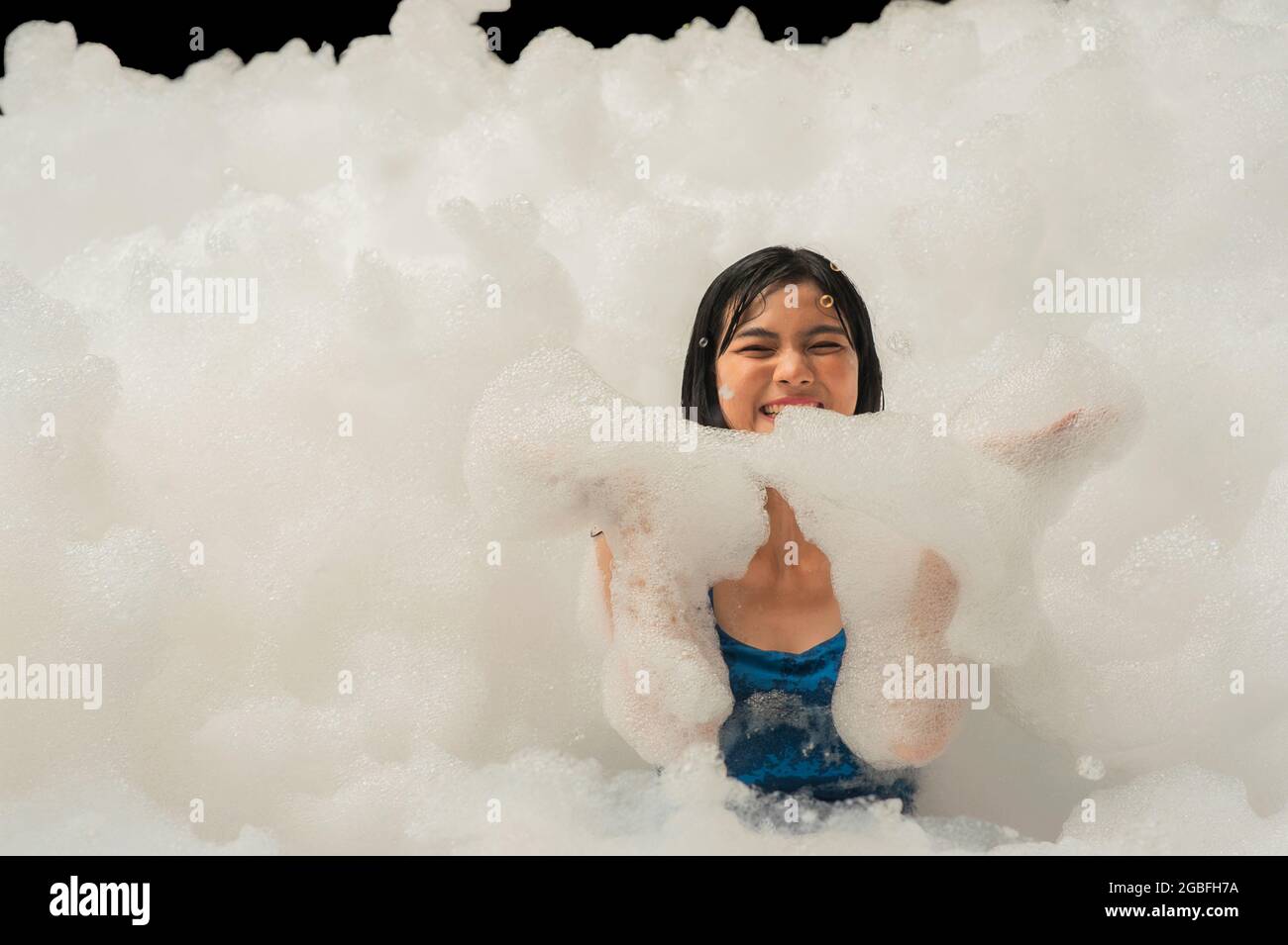 Girl dancing foam party in hi-res stock photography and images - Alamy