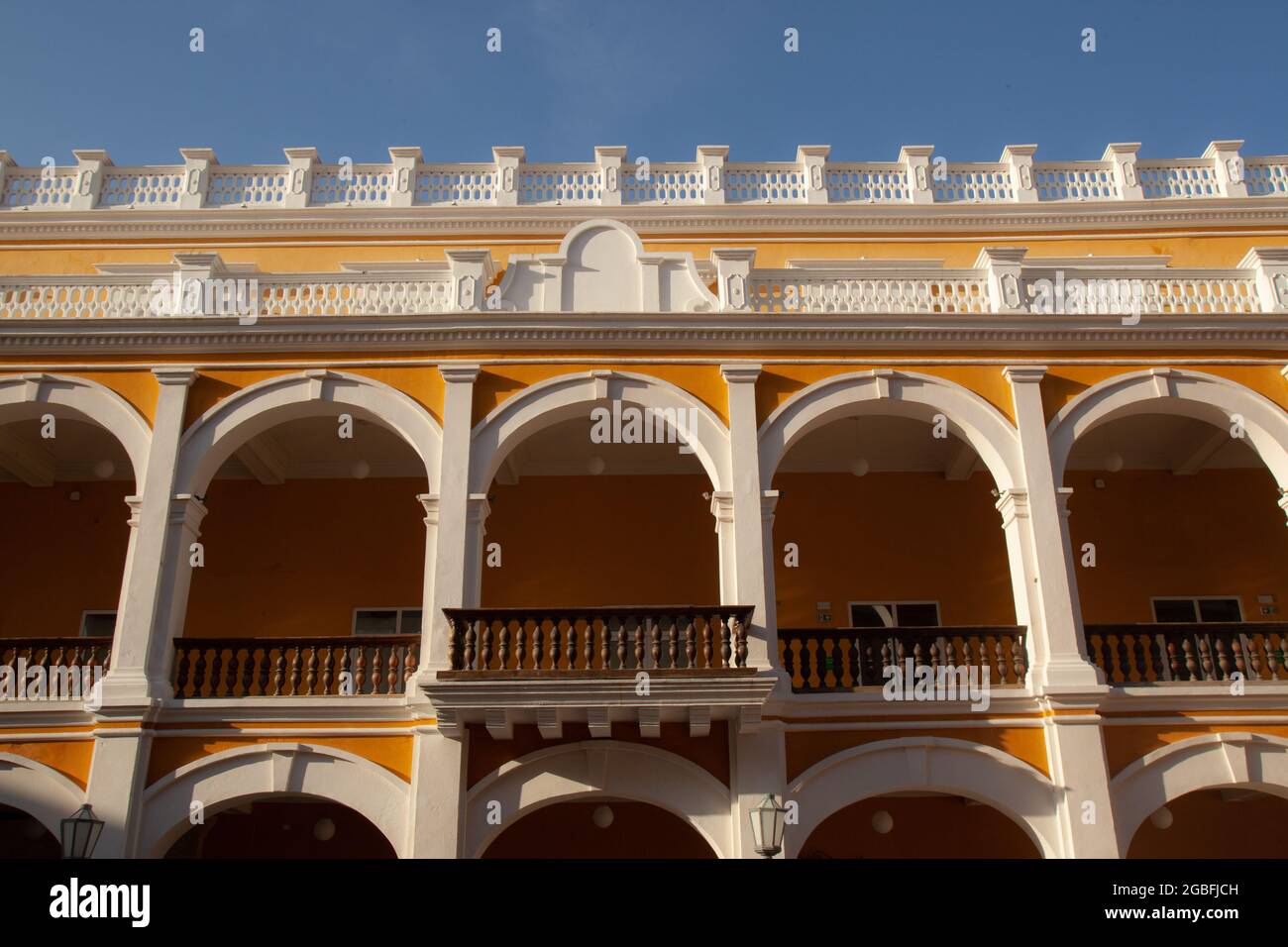 Bright yellow building in Colombia Stock Photo - Alamy