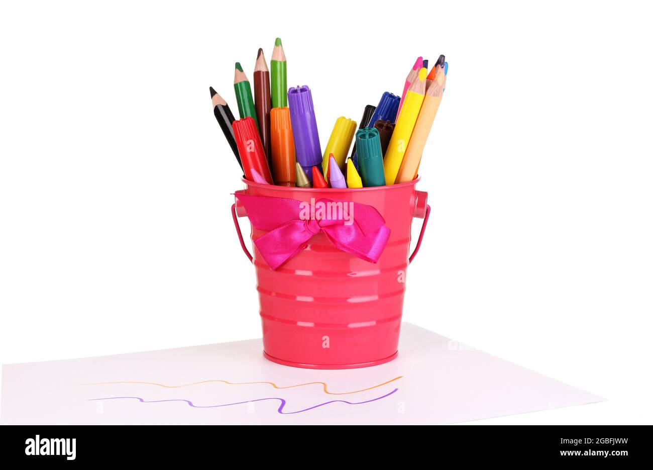 Colorful pencils and felt-tip pens in pink pail isolated on white Stock ...