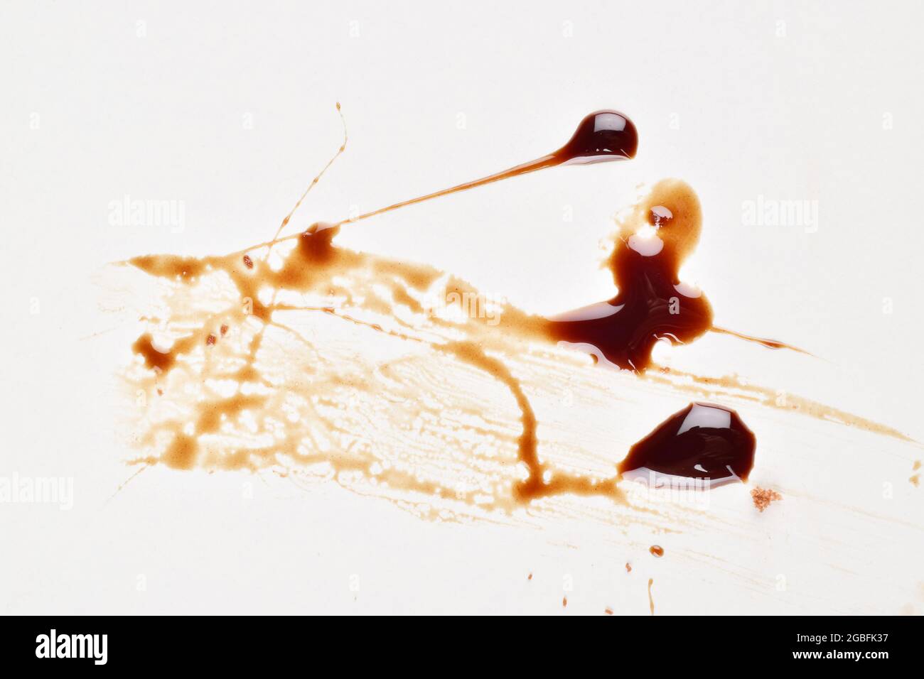 Chocolate syrup stain isolated on white background Stock Photo - Alamy