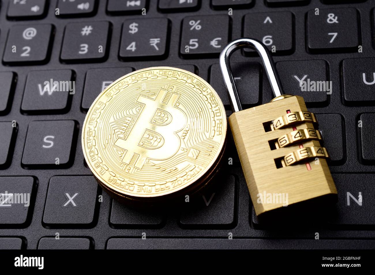 bitcoin security concept. Gold coin with padlock on keyboard Stock ...