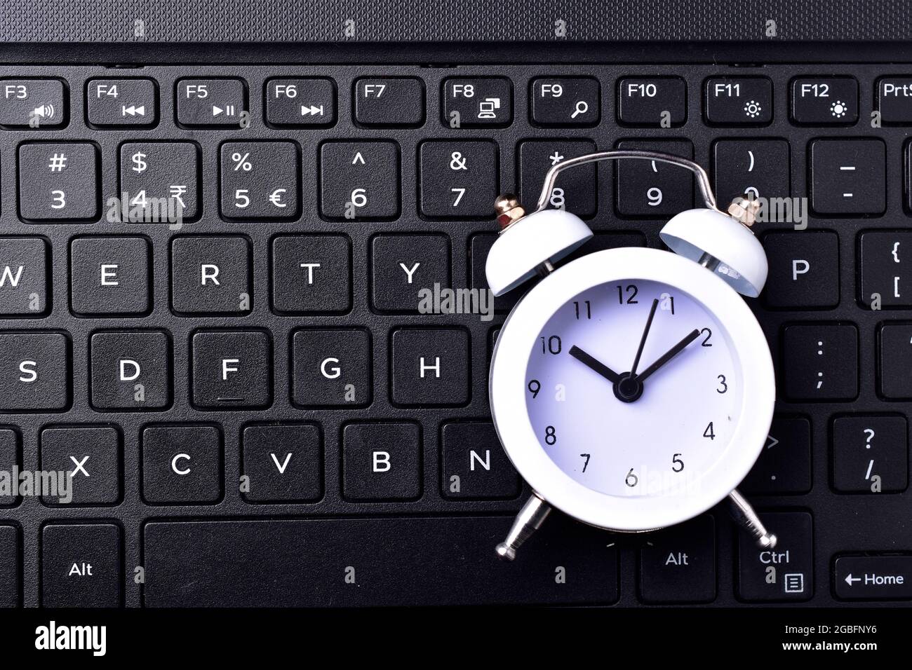clock on keyboard concept for time management and countdown to deadline ...