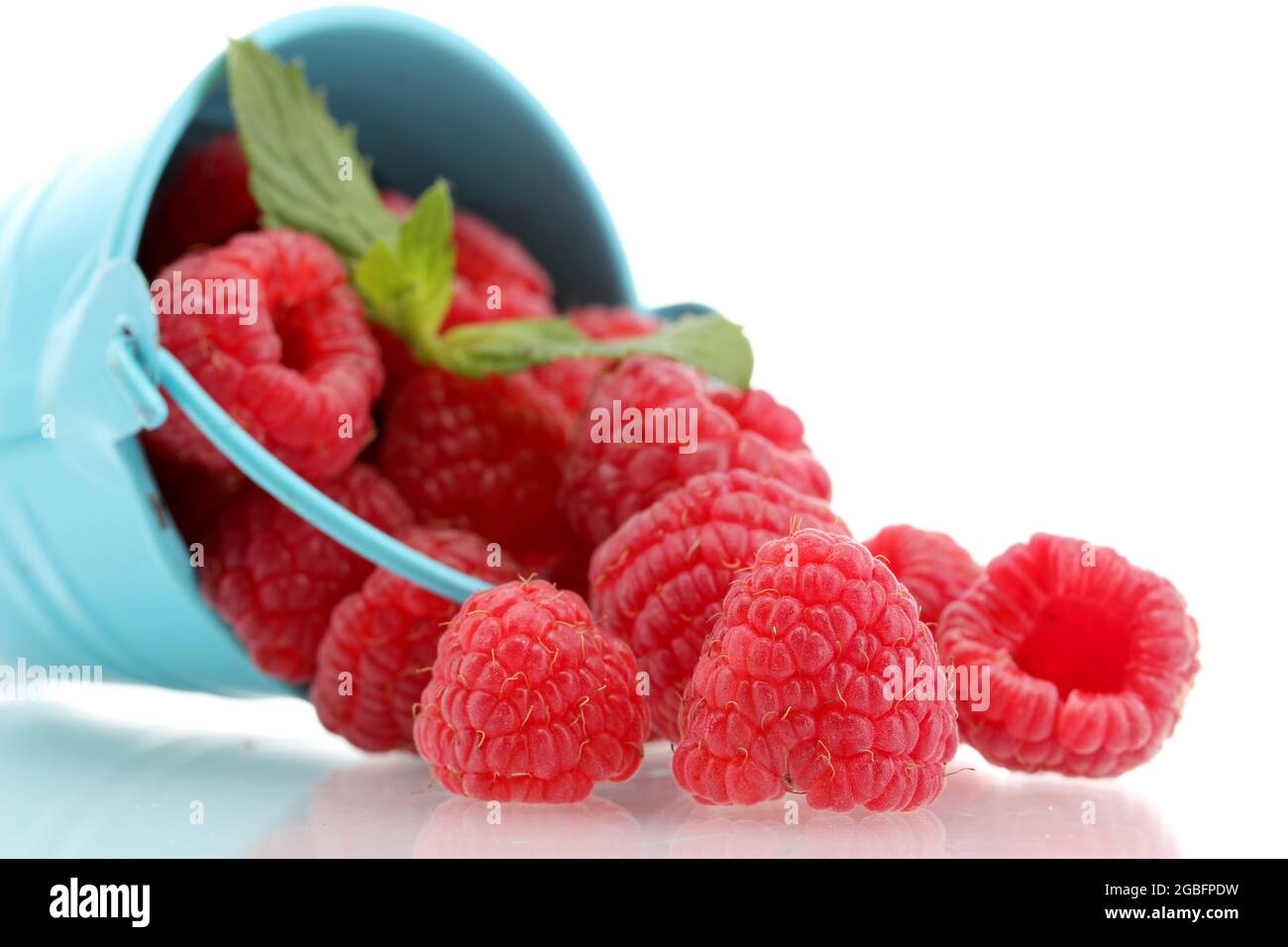 beautiful raspberries in bucket isolated on white Stock Photo - Alamy