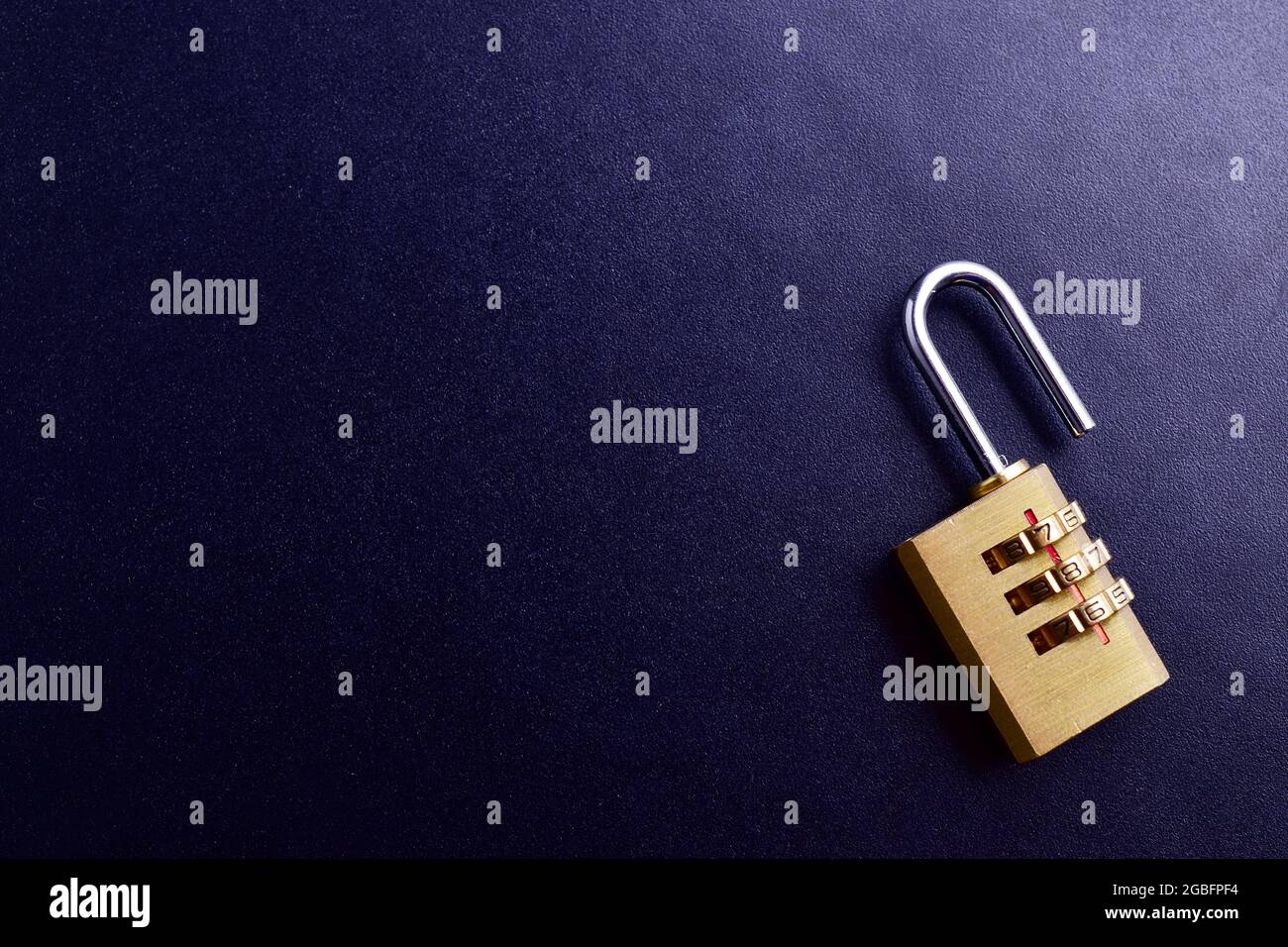 unlocked padlock on black textured background Stock Photo - Alamy