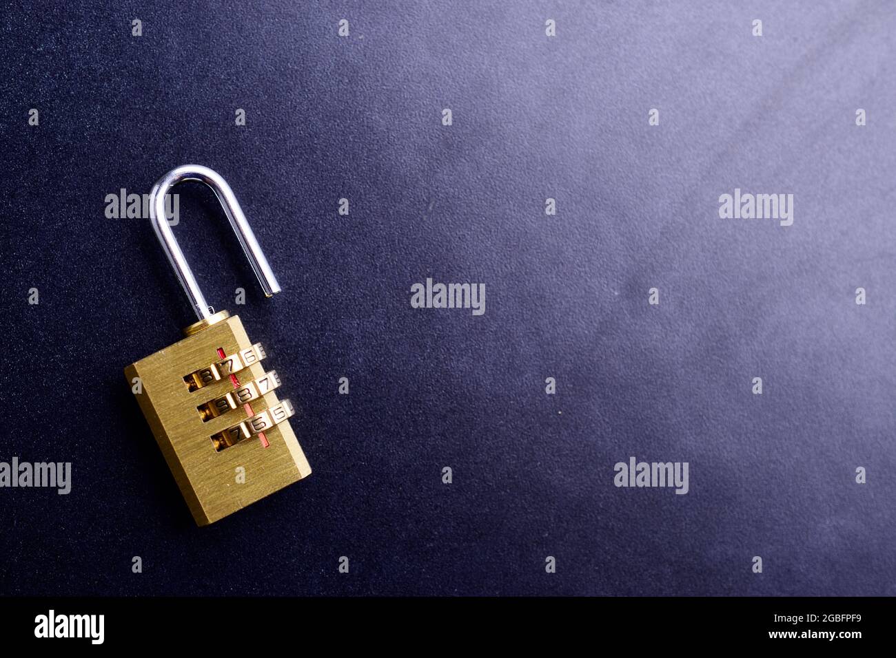 unlock padlock on black textured background Stock Photo - Alamy