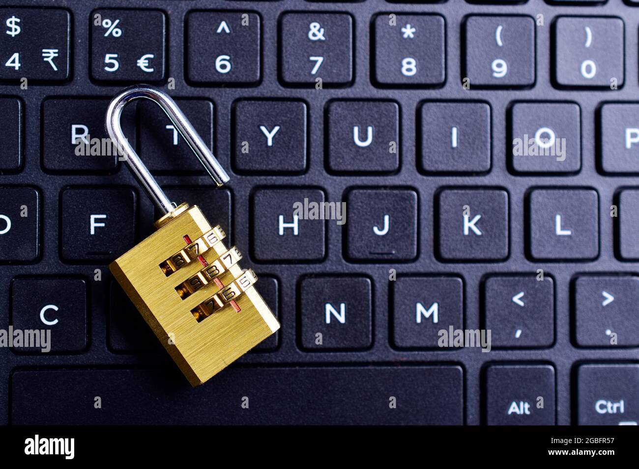 Close-up of a unlocked padlock on a keyboard. Concept photo of ...
