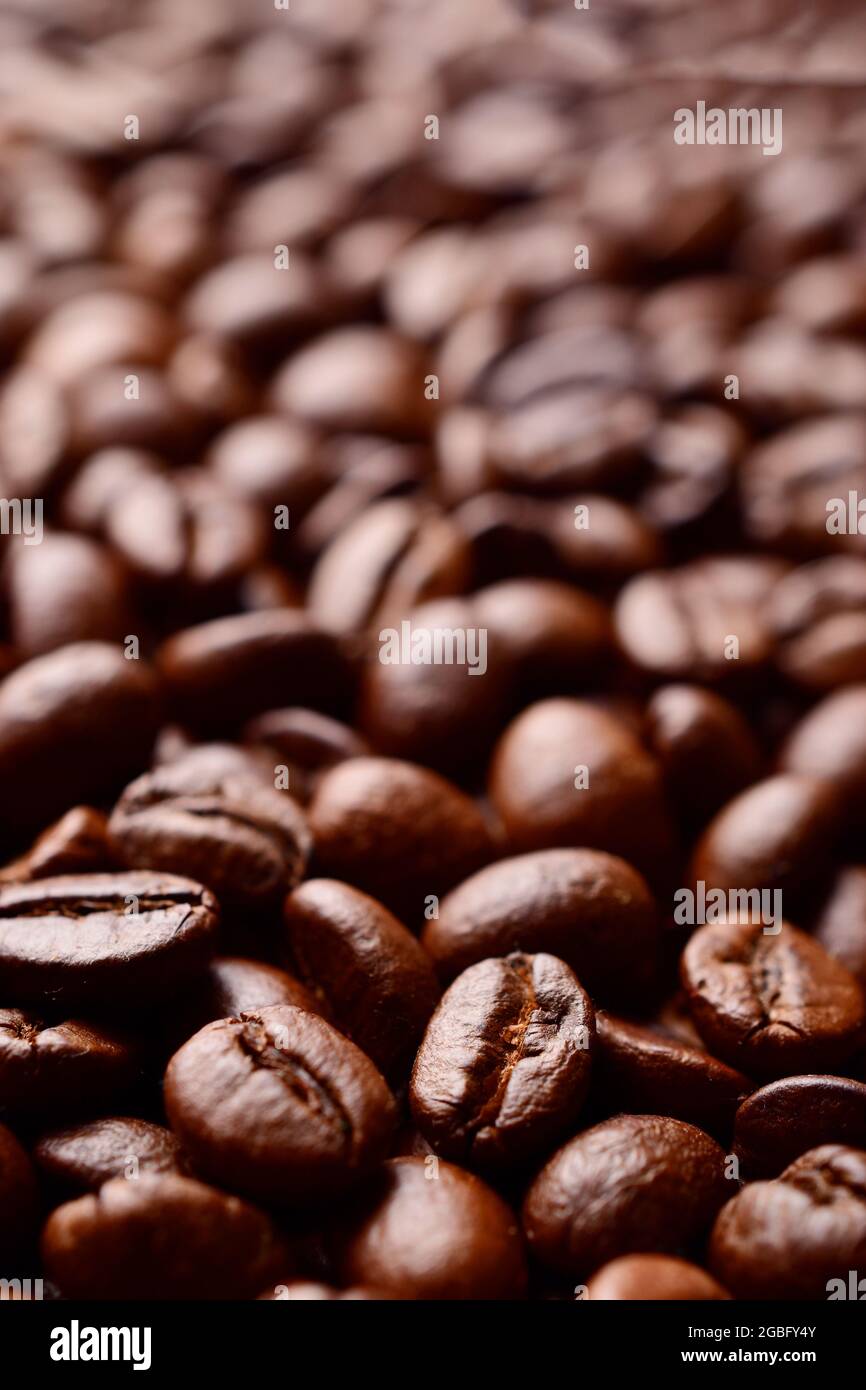 Coffee beans closeup texture background Stock Photo - Alamy