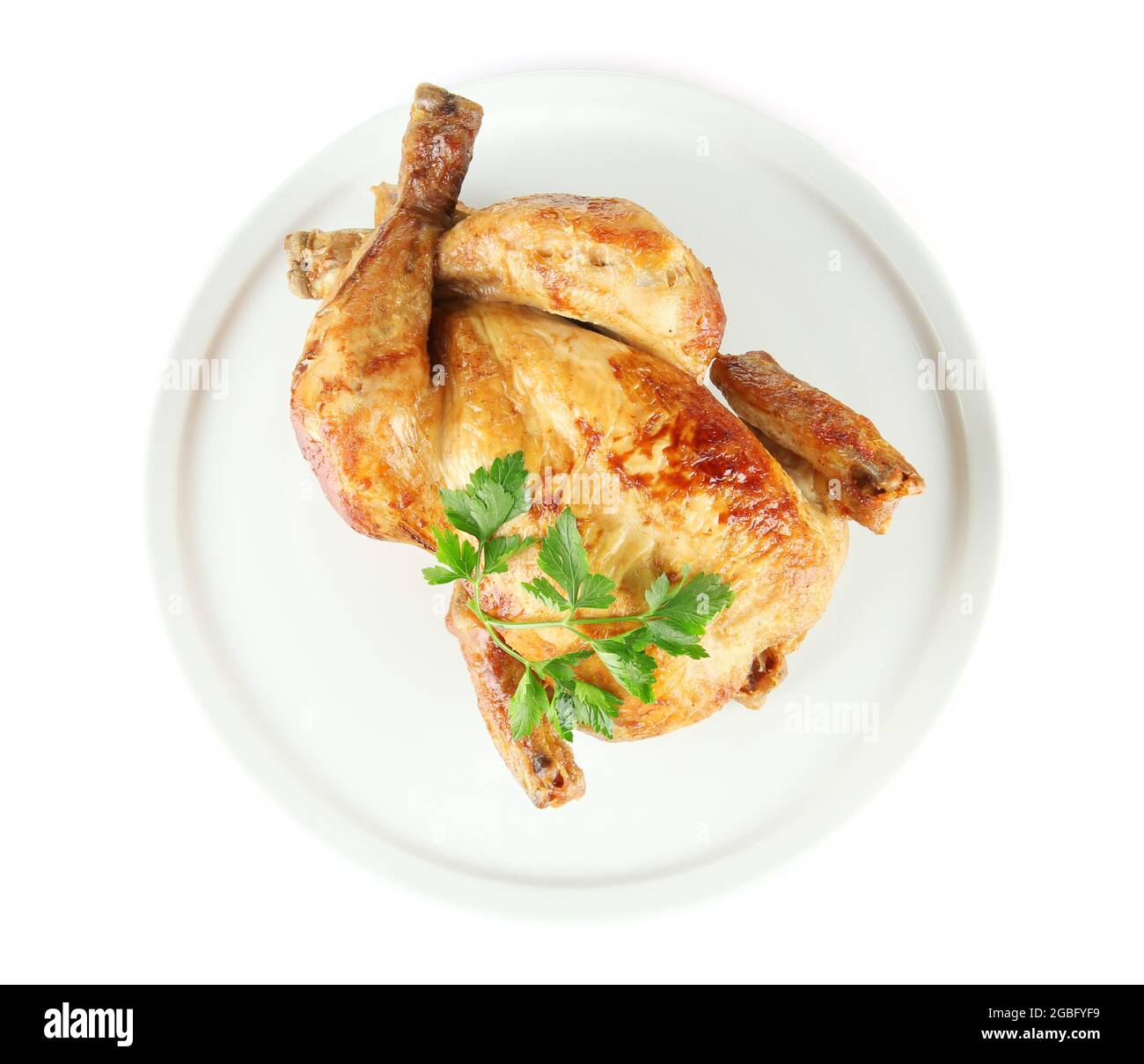 Roasted whole chicken on a white plate isolated on white Stock Photo ...