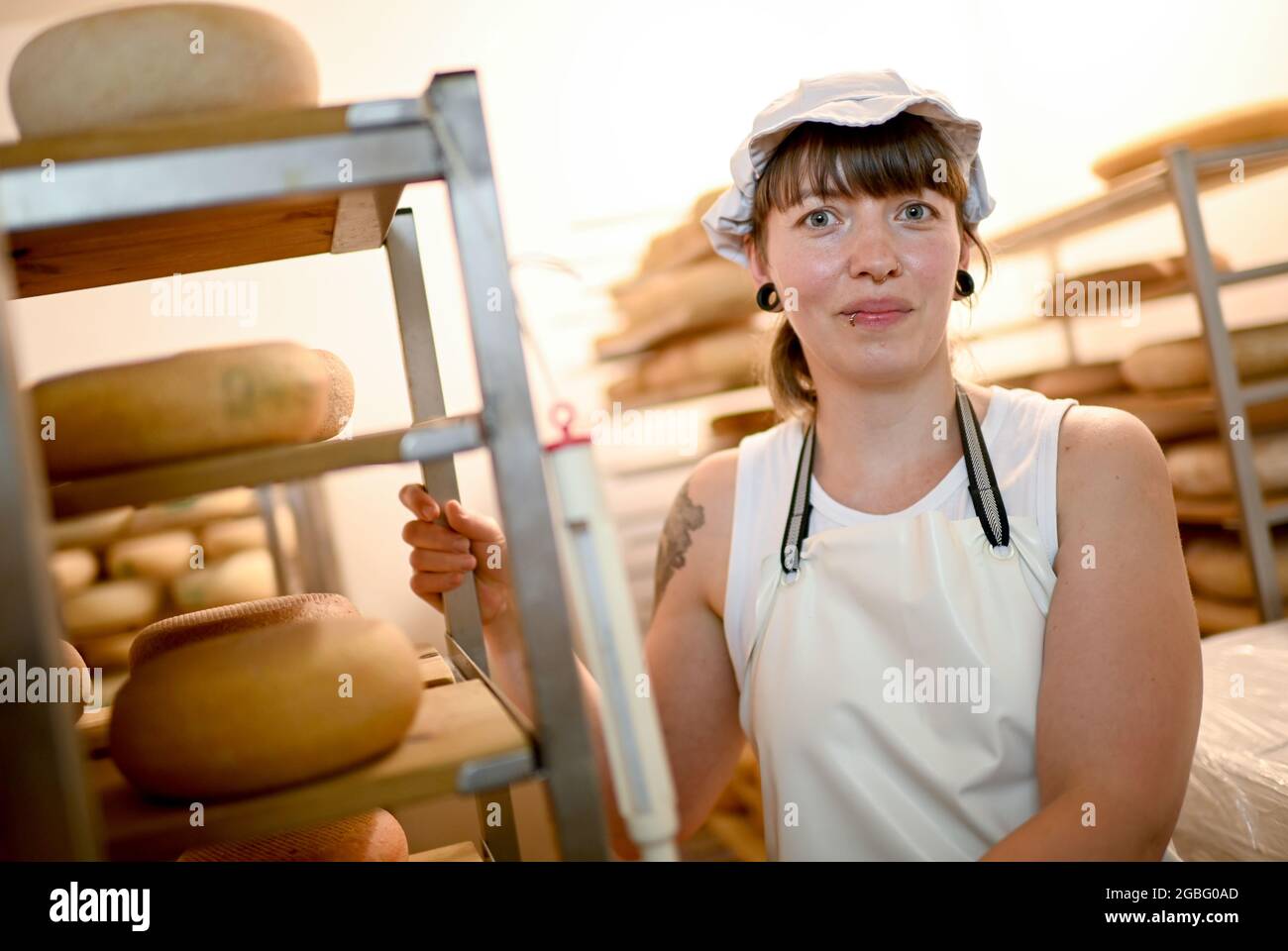 Karolinenhof, Germany. 30th July, 2021. Farmer Sarah Spindler stands in ...