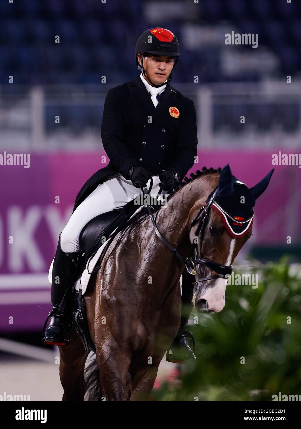 TOKYO, JAPAN - JULY 30: Huadong Sun of China competing on Eventing ...