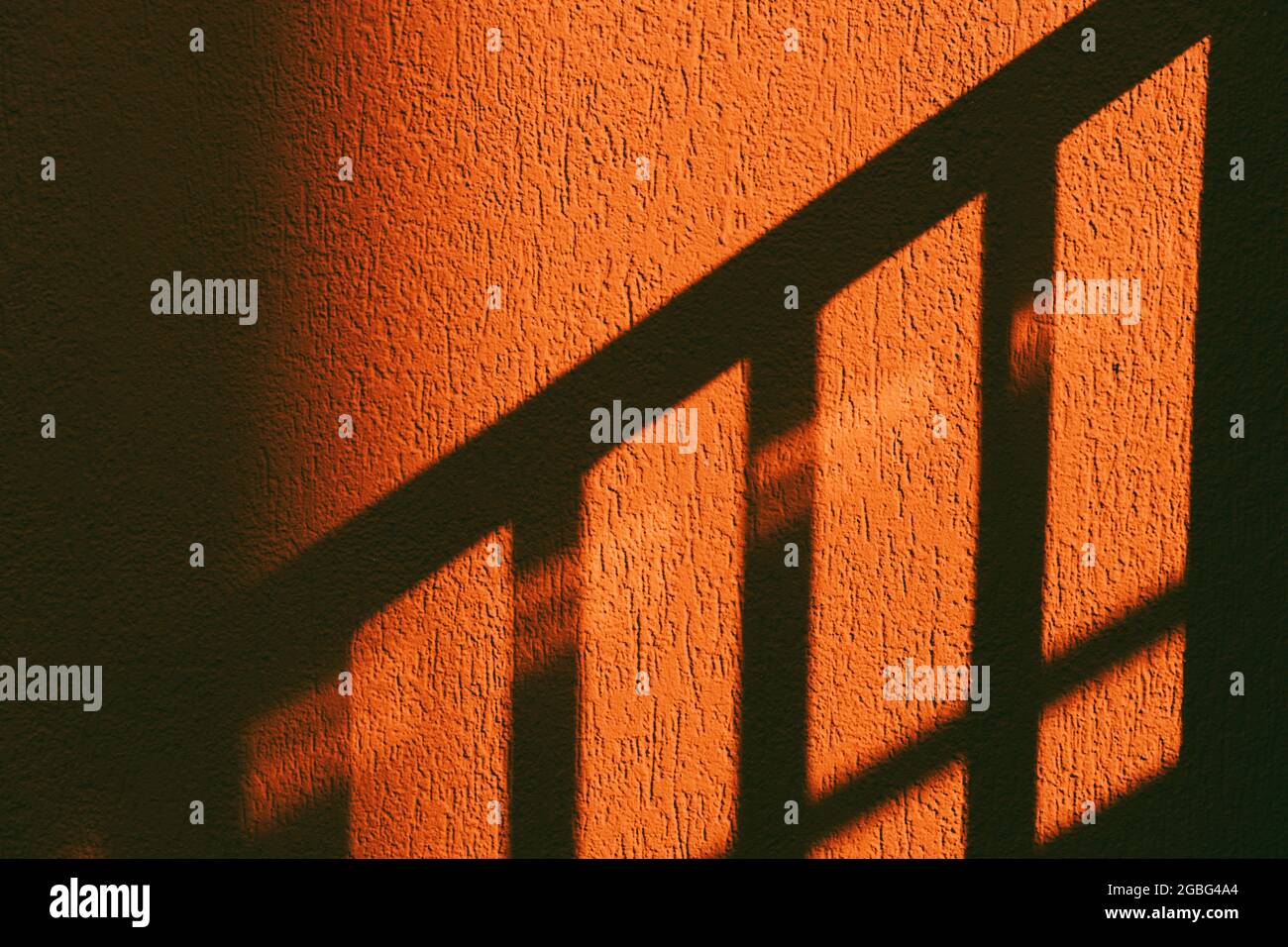 Shadow of stairs on a red textured wall Stock Photo - Alamy