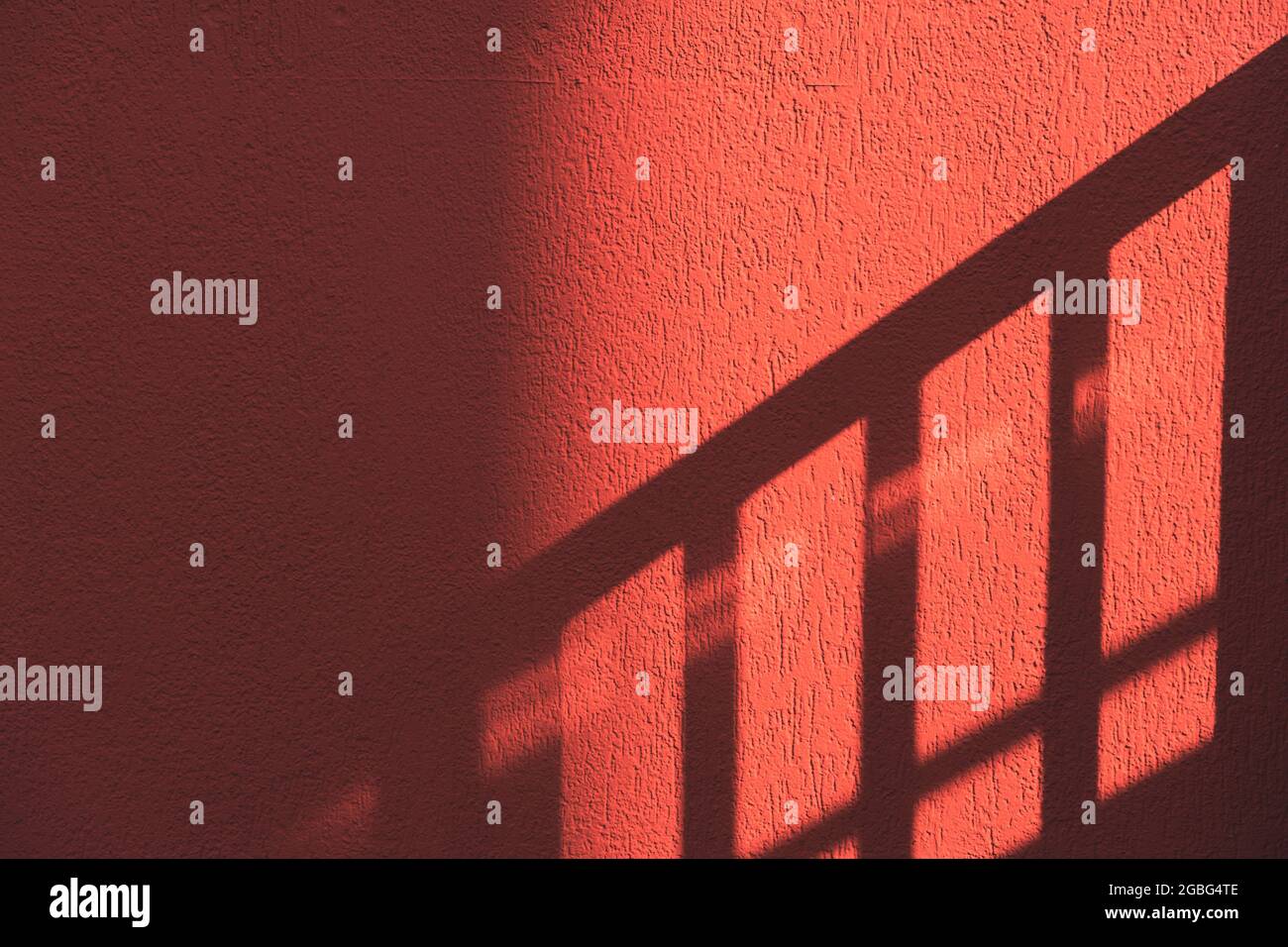 Shadow of stairs on a red texture Stock Photo - Alamy