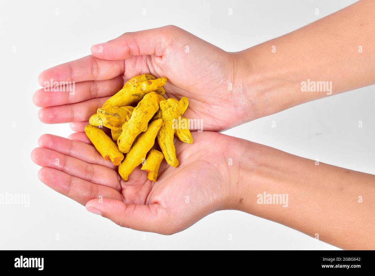 Raw Turmeric In Hand Isolated On White Background With Clipping Path ...