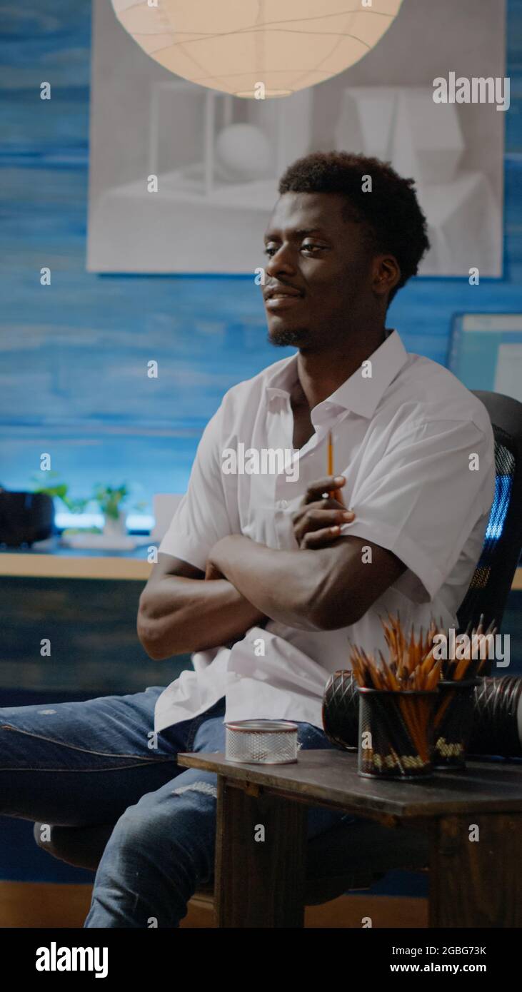 Adult of african american ethnicity designing vase on canvas for ...