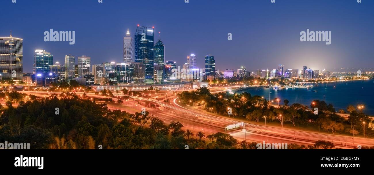 Panoramic evening view of Perth city skyscrapers and Freeway seen from ...