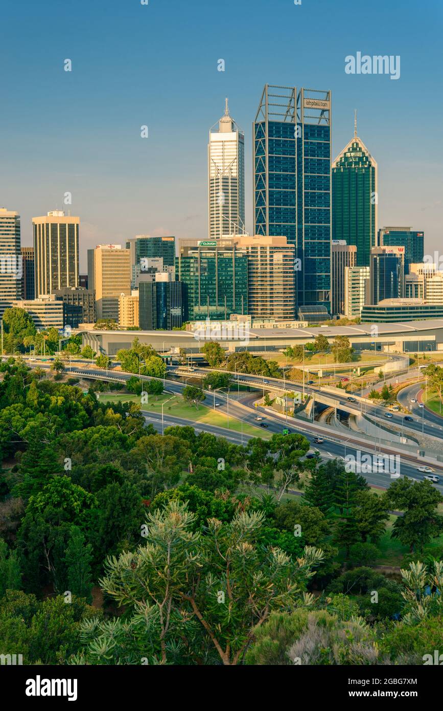 Late afternoon view of Perth city skyscrapers and Mitchell Freeway seen ...