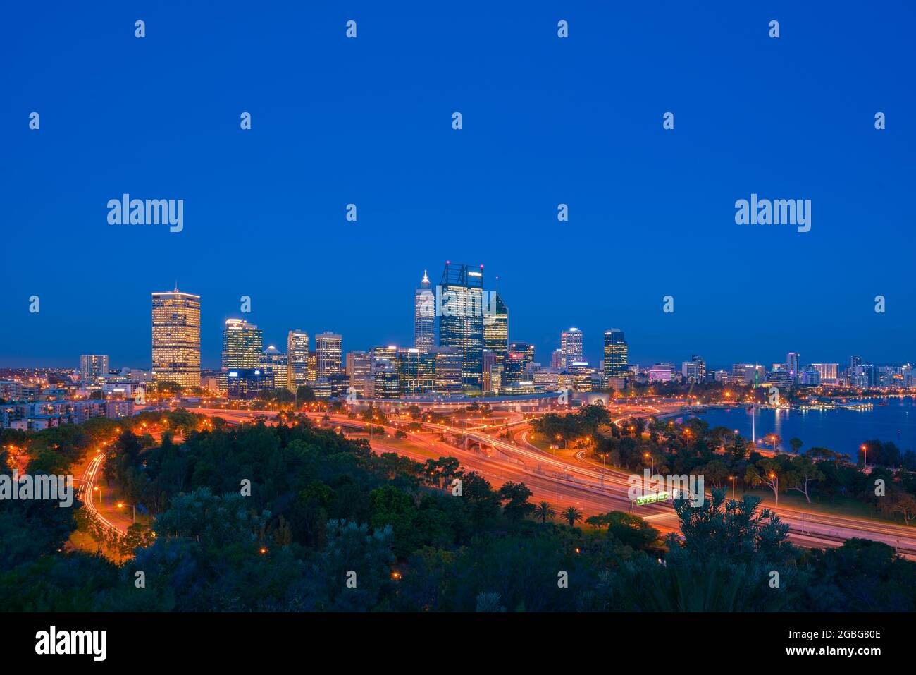 Evening view of Perth city skyscrapers and Mitchell Freeway seen from ...