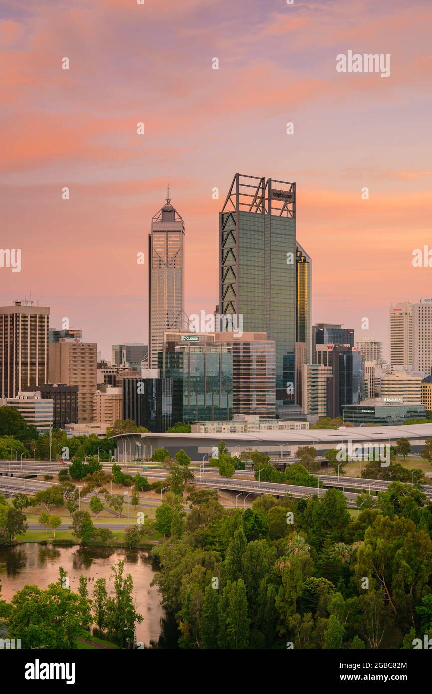 Late afternoon view of Perth city skyscrapers and Mitchell Freeway seen ...