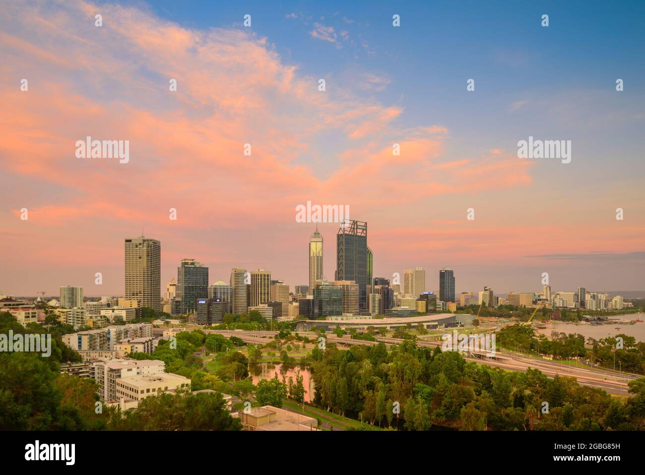 Late afternoon view of Perth city skyscrapers and Mitchell Freeway seen ...