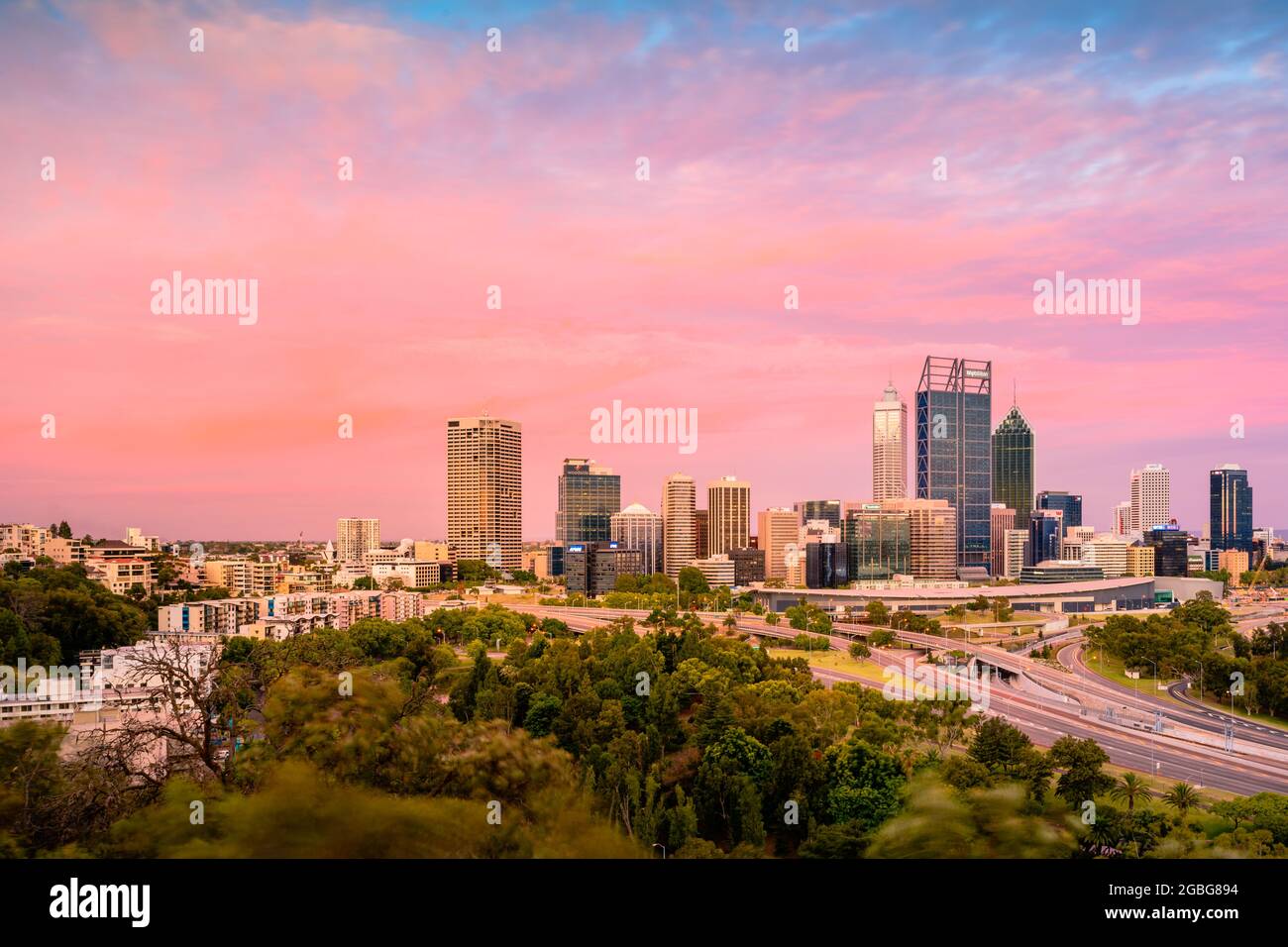 Late afternoon view of Perth city skyscrapers and Mitchell Freeway seen ...