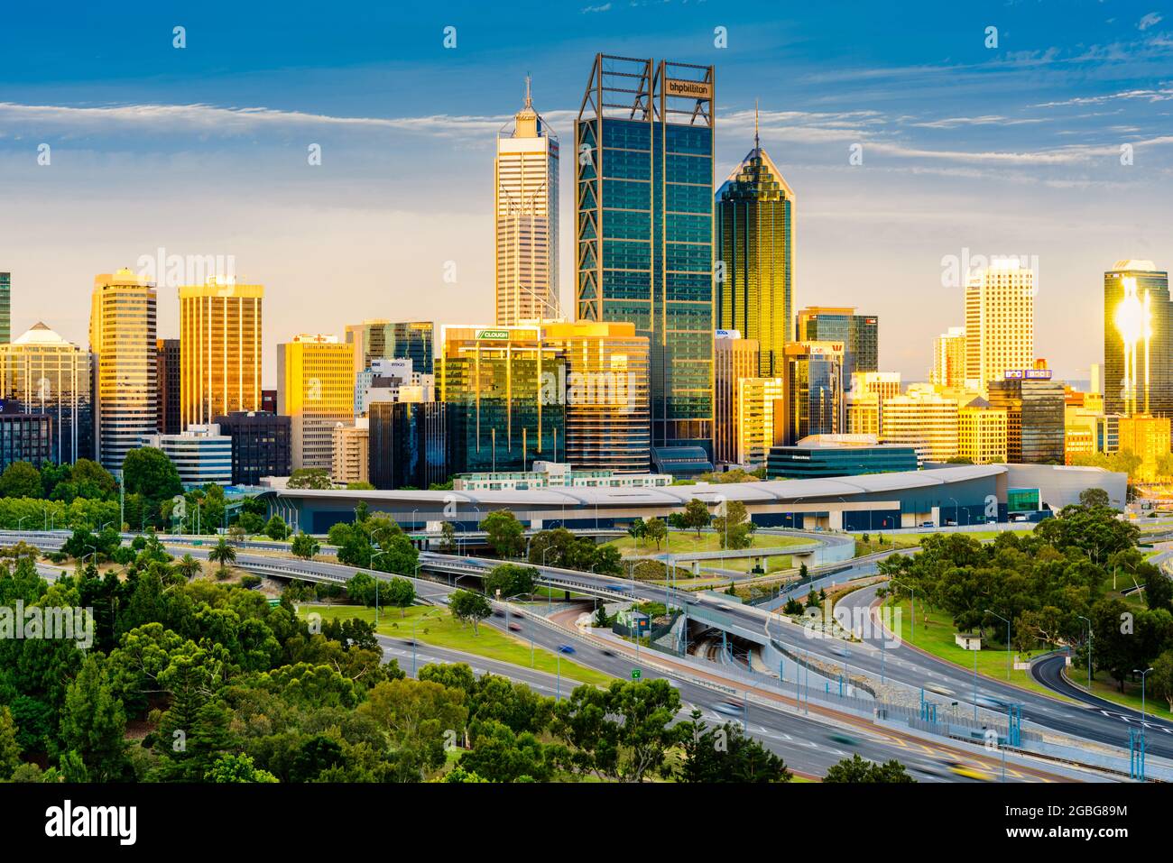 Late afternoon view of Perth city skyscrapers and Mitchell Freeway seen ...