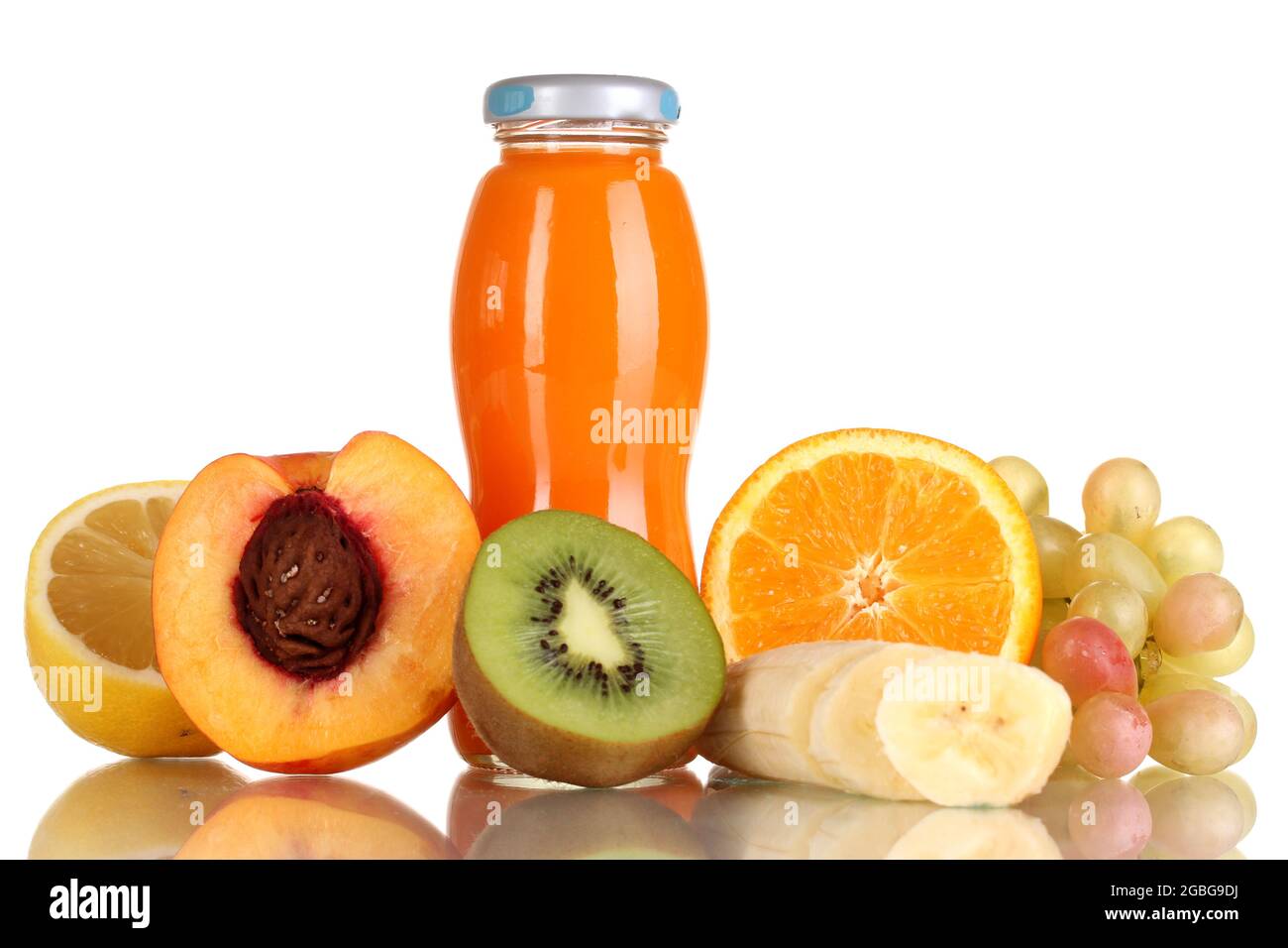 Delicious multifruit juice in a bottle and fruit next to it isolated on ...