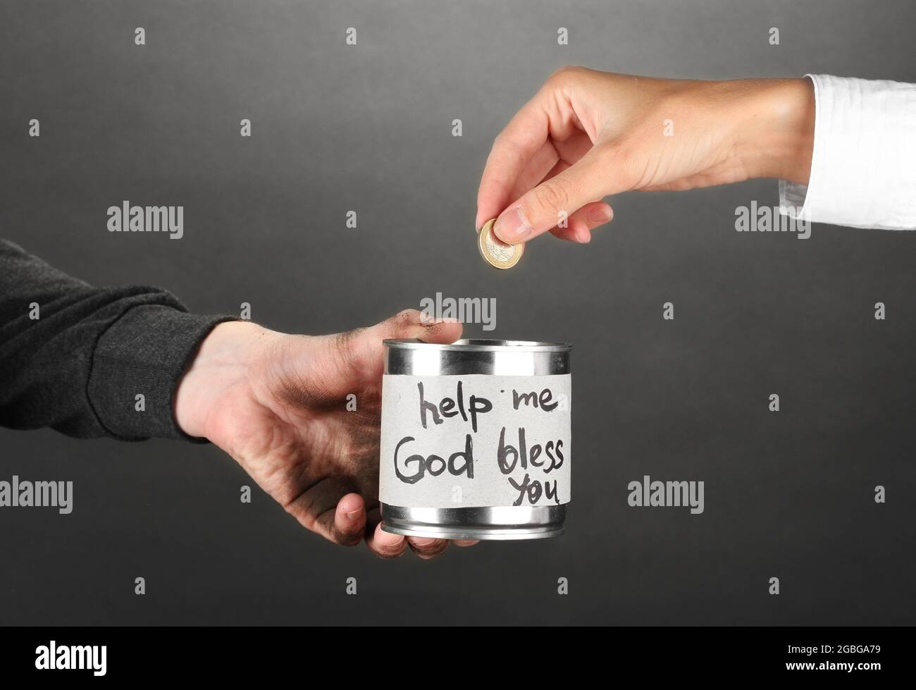helping the homeless, on black background close-up Stock Photo - Alamy