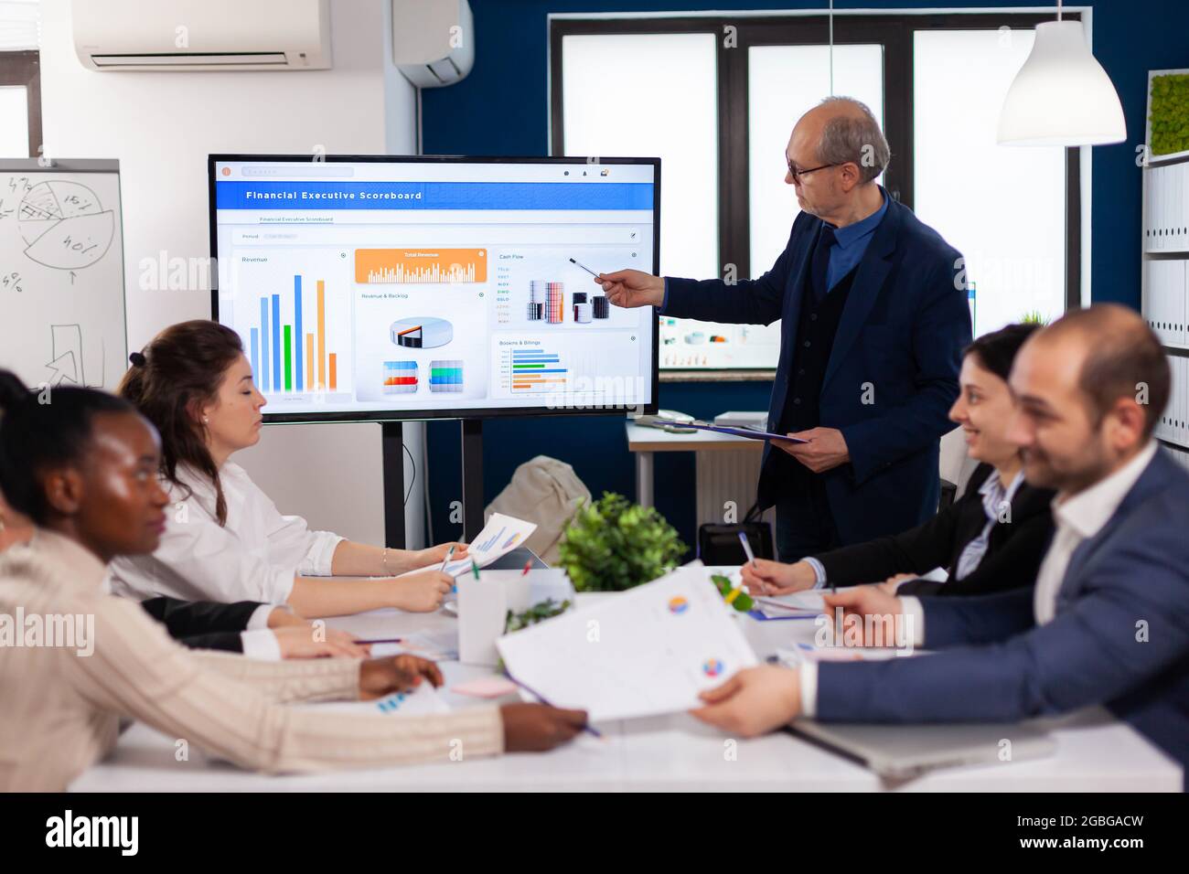 Senior team leader explaining presentation discussion in conference ...