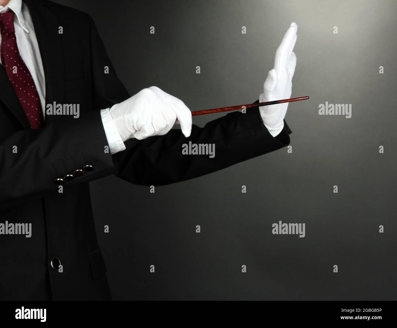 magician performance on dark background Stock Photo - Alamy
