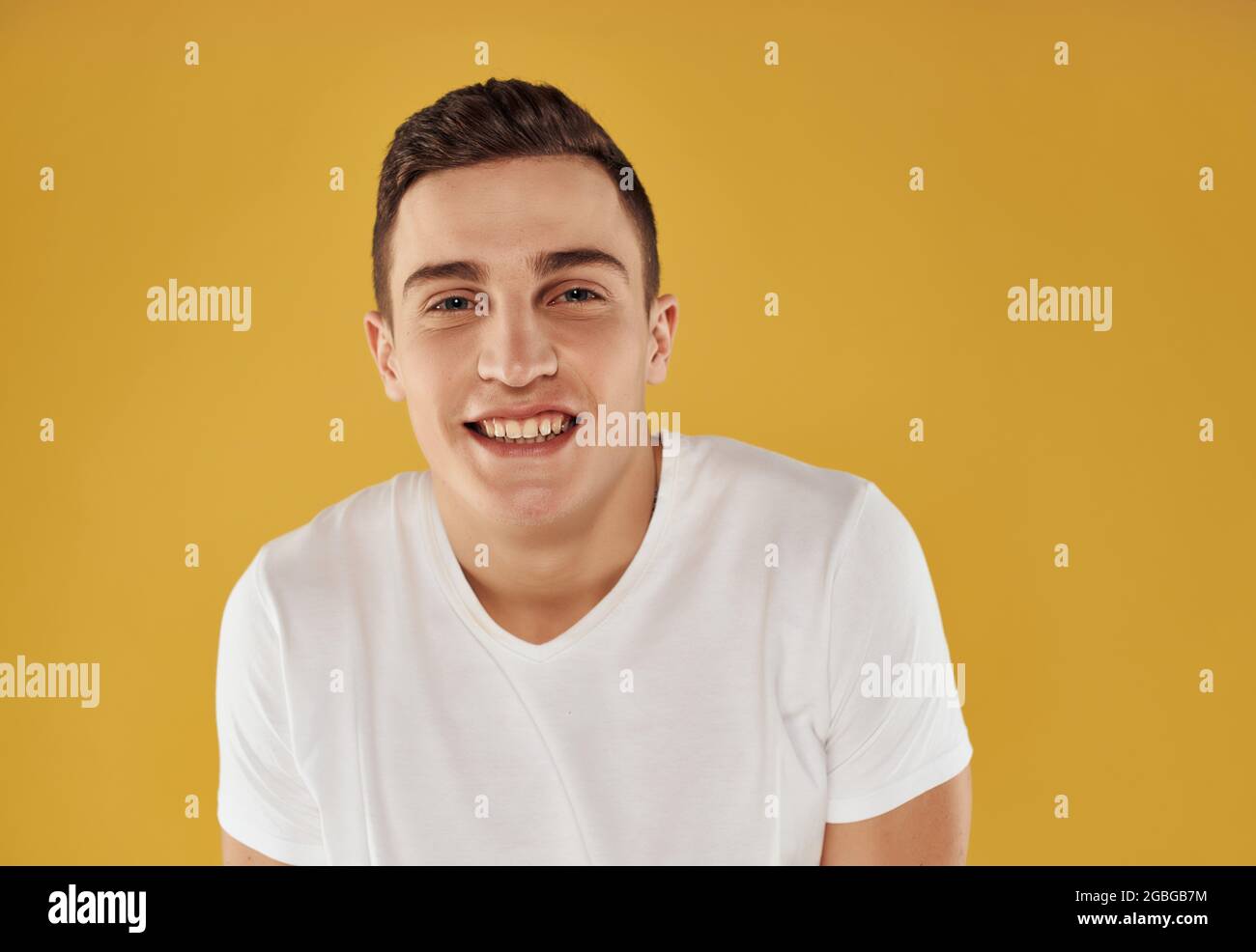 handsome man in white t-shirt confident look cropped view yellow ...