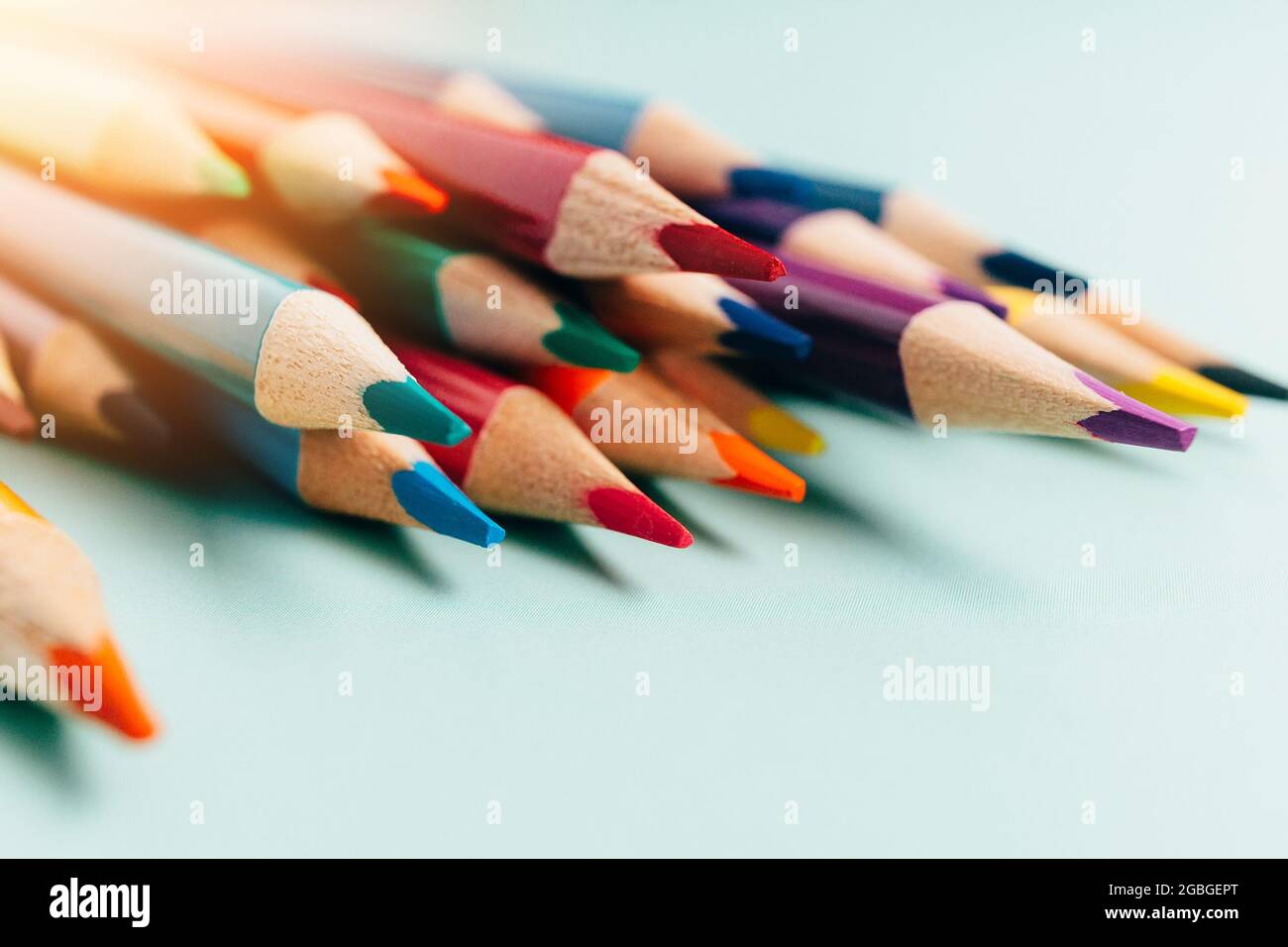 Sharp colored pencils for drawing lie on the table. Accessories for ...