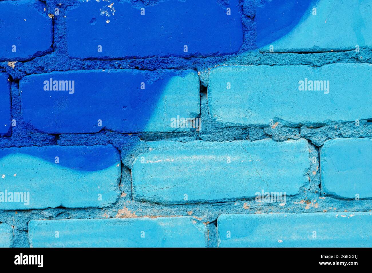 A close-up of the blue brick wall. Fragment of an exterior wall painted ...