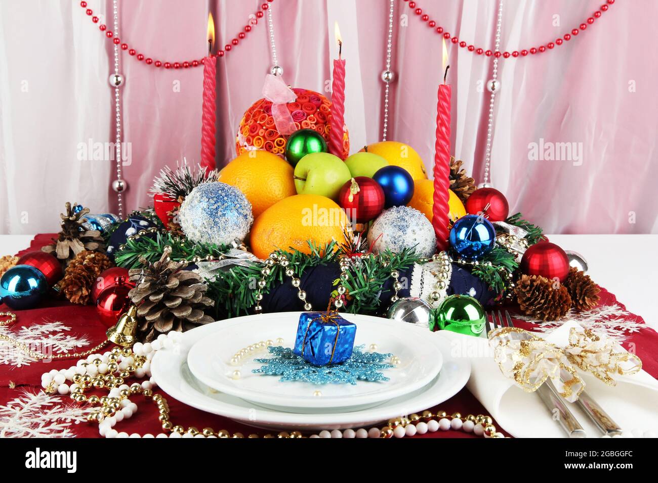 Serving Christmas table on white fabric background Stock Photo - Alamy
