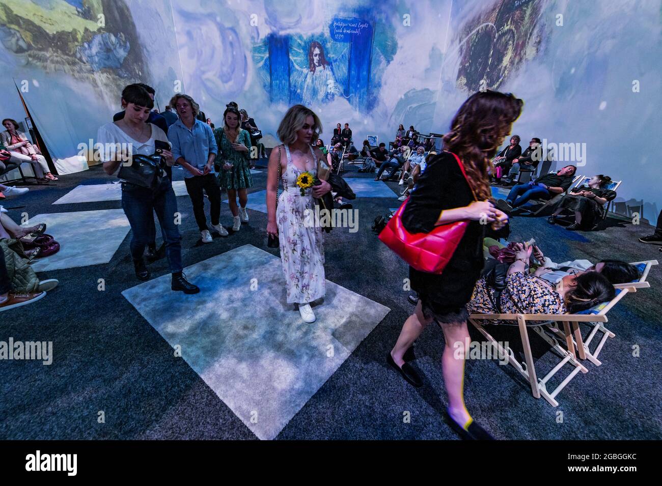 London, UK. 3rd Aug, 2021. The main room with a rolling projection of ...