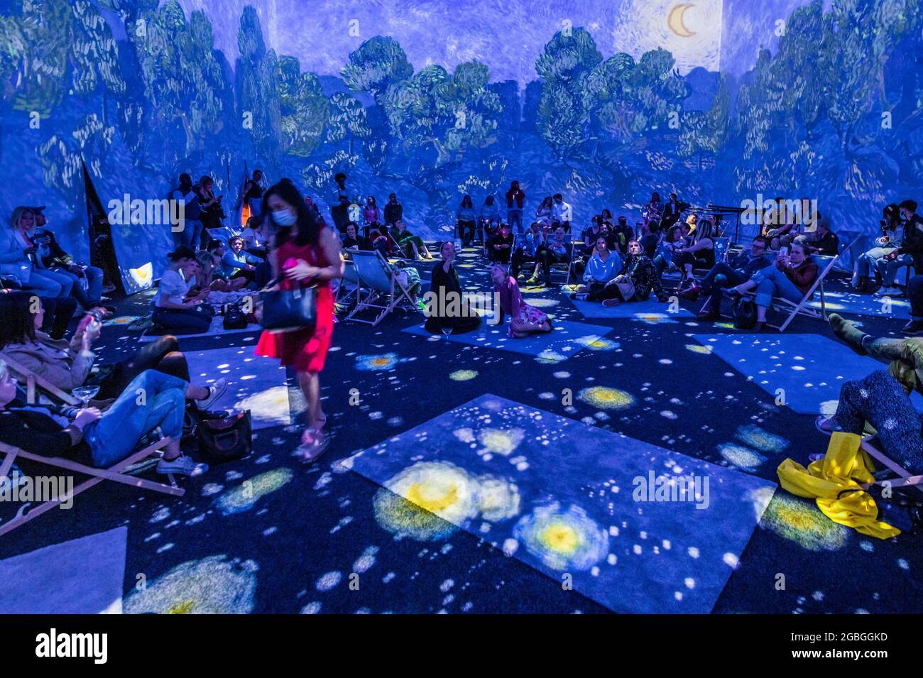 London, UK. 3rd Aug, 2021. The main room with a rolling projection of ...