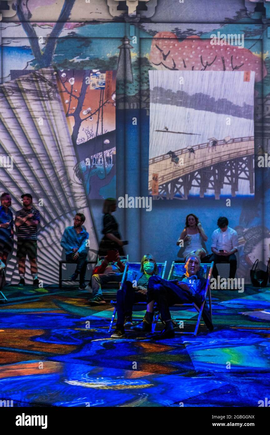 London, UK. 3rd Aug, 2021. The main room with a rolling projection of ...