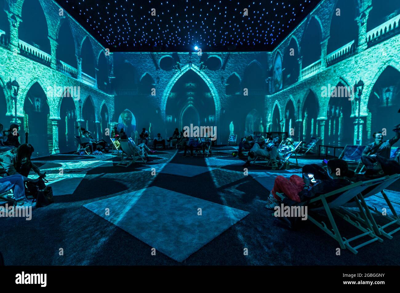 London, UK. 3rd Aug, 2021. The main room with a rolling projection of ...
